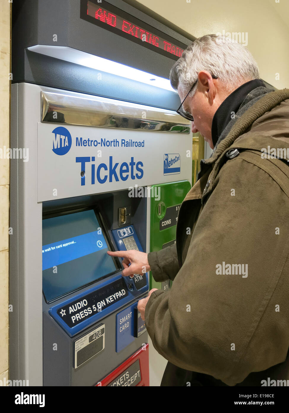 Man Purchasing Metro North Transit Train Tickets at Self Serve Vending ...