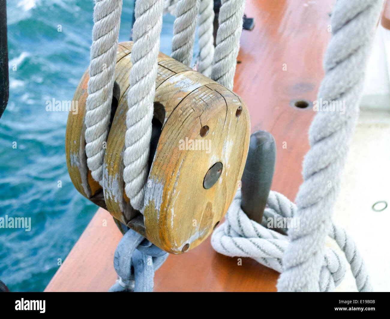 Close-up of a rope tied up with a pulley of boat Stock Photo - Alamy