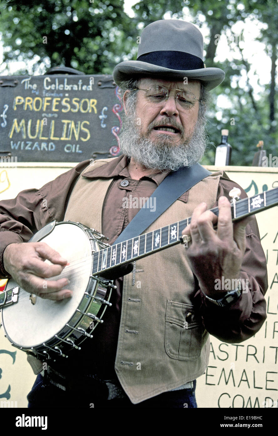 Professor Mullins performs on a banjo during his outdoor medicine show ...