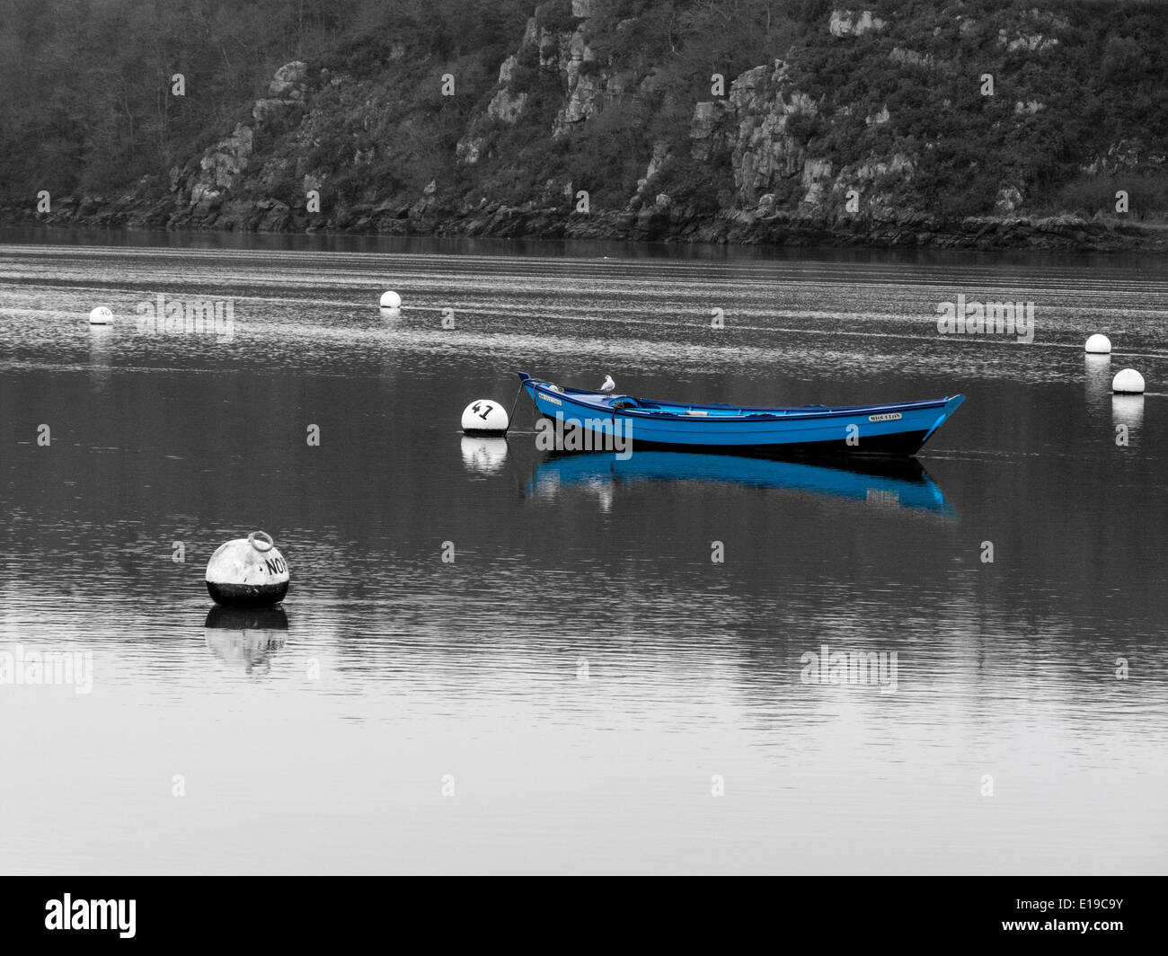 Blue rowboat and buoys in the sea Stock Photo - Alamy
