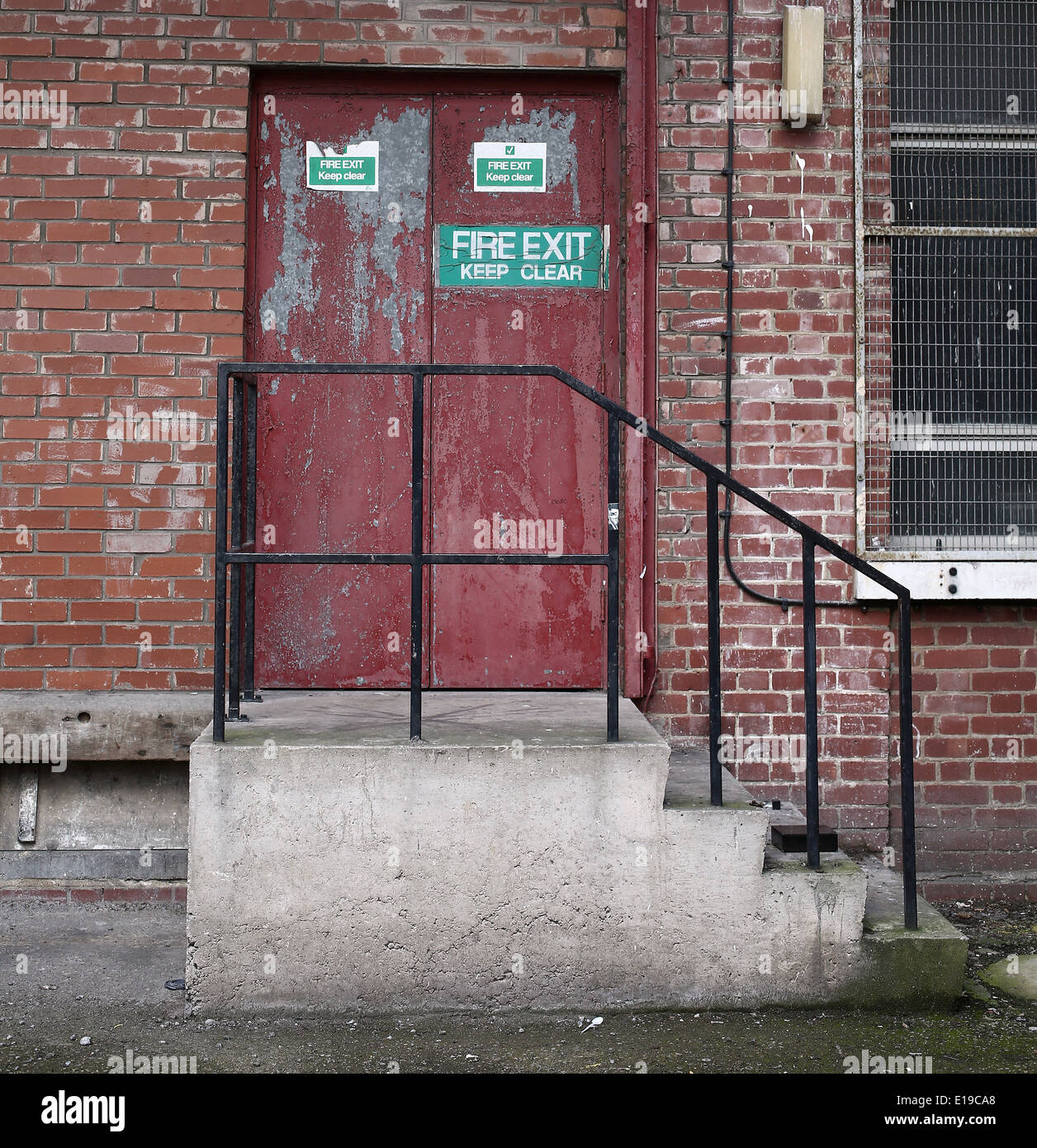Fire exit door with steps into the service yard at the back of a ...