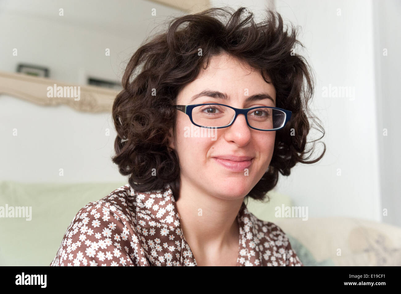 Young woman wearing spectacles Stock Photo - Alamy