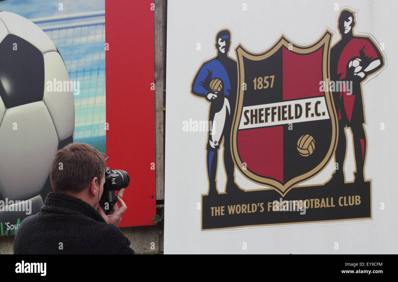 A ma photographs a sign outside Sheffield Football Club; the world's ...