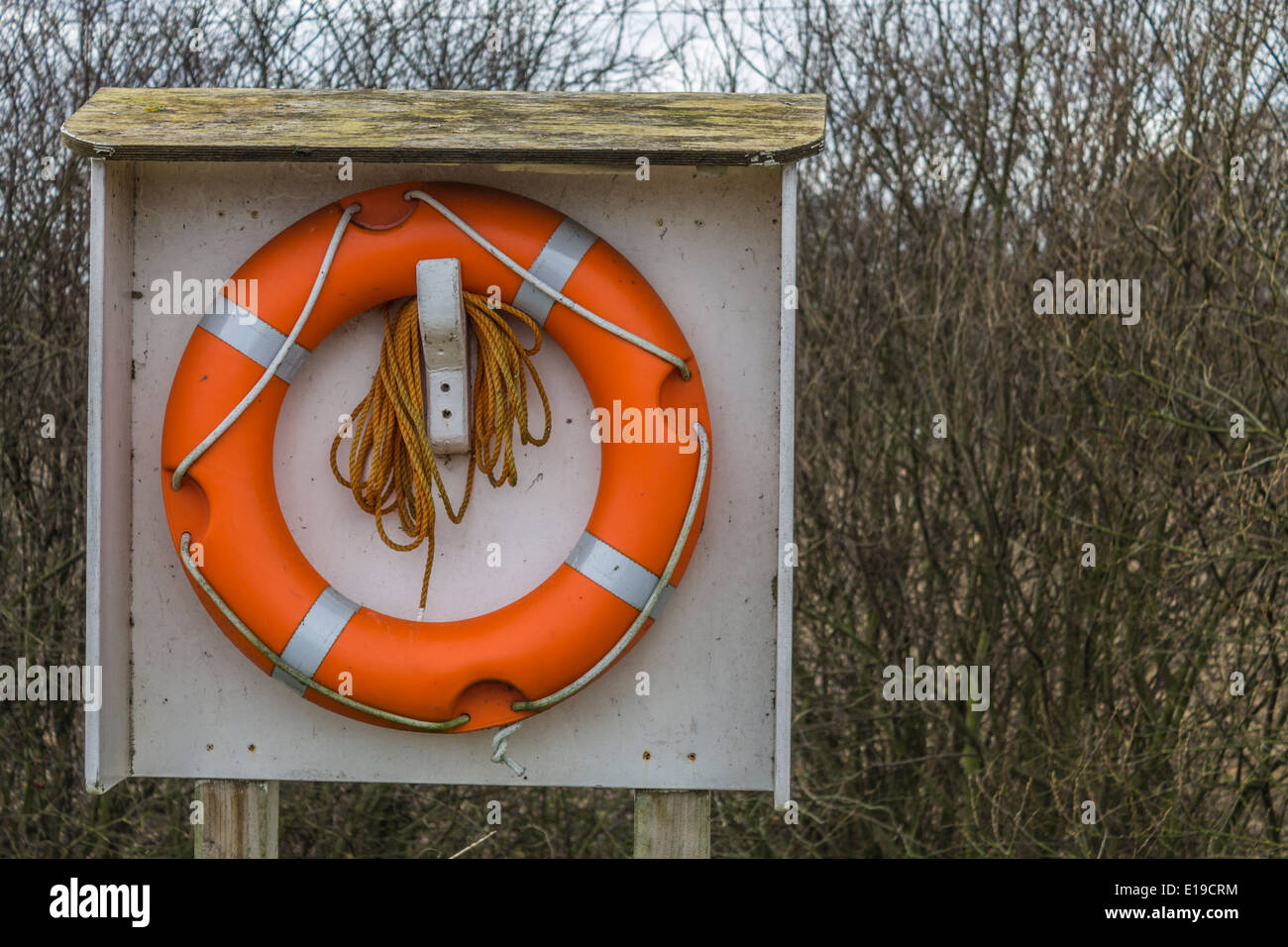 Orange life preserver at a canal Stock Photo - Alamy