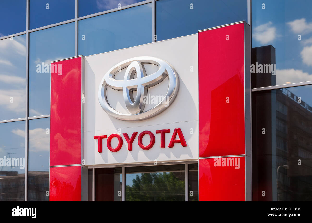 The emblem Toyota on the office of official dealer Stock Photo - Alamy