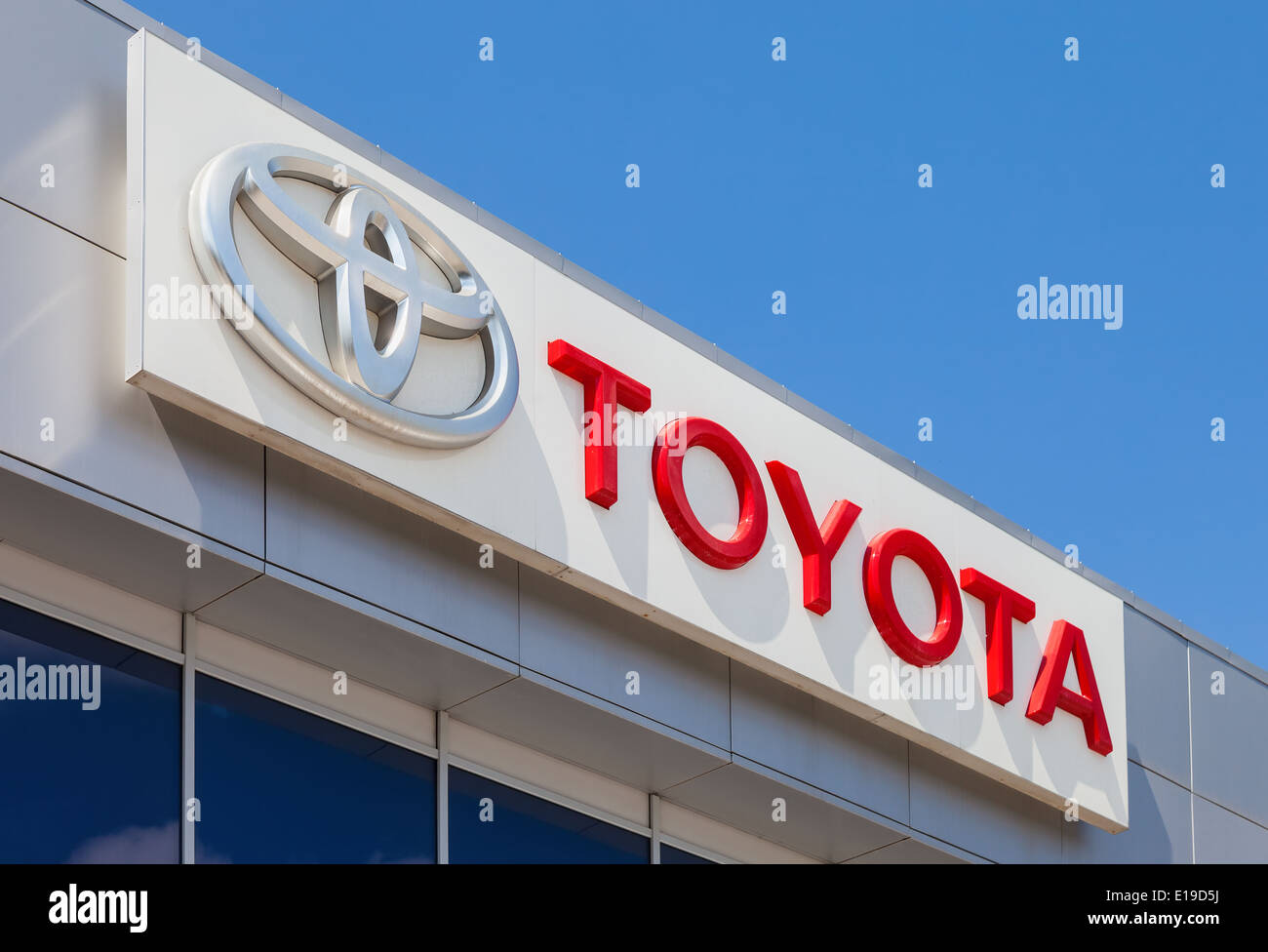 The emblem Toyota on the office of official dealer Stock Photo - Alamy