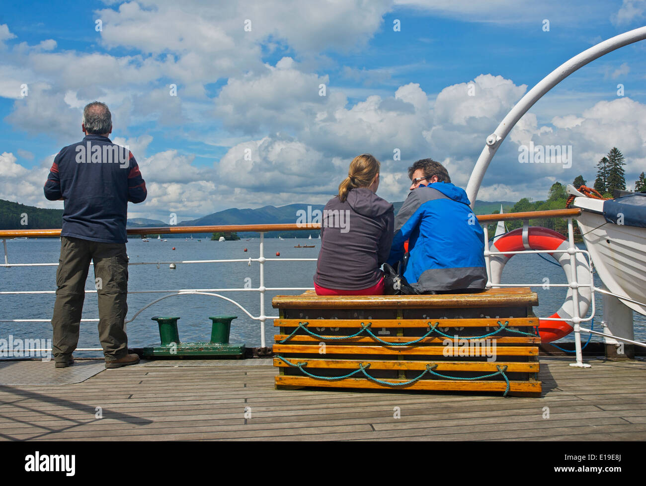 Three passengers on 'steamer', operated by Windermere Lake Cruises ...
