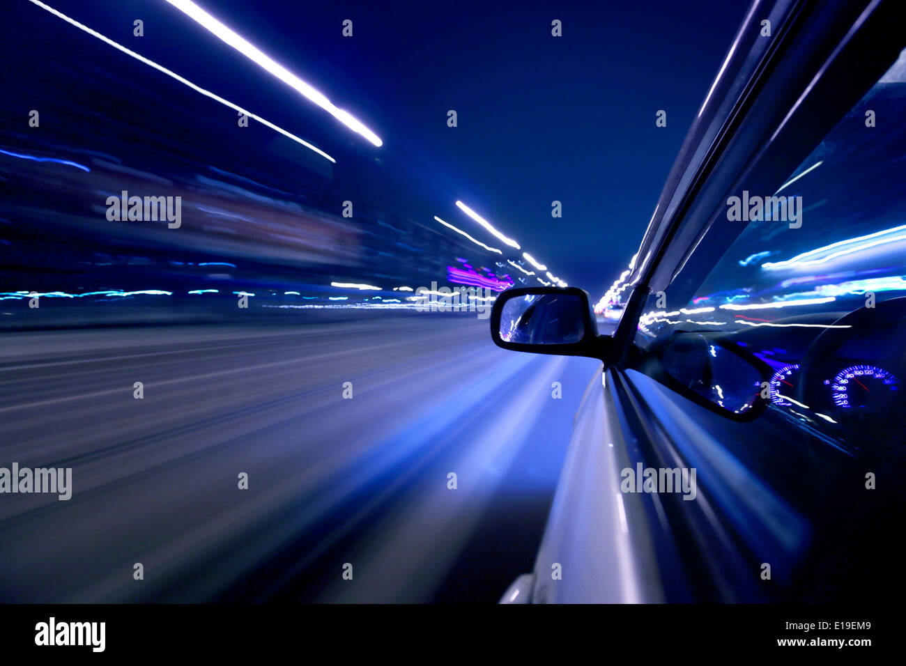 Side view on moving fast car at night Stock Photo - Alamy