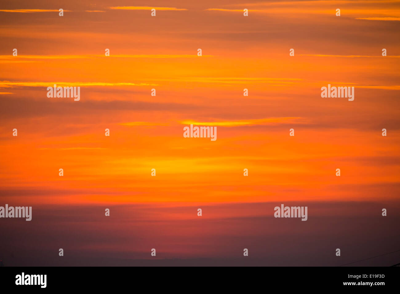 The sky just before sunrise, shades of red, yellow and orange Stock ...