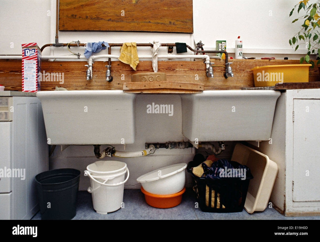 Old sinks in large house utility area Stock Photo - Alamy