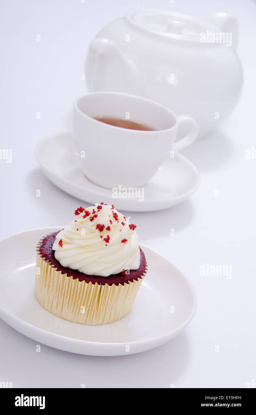 ared velvet cupcake with a cup of tea in white background Stock Photo ...