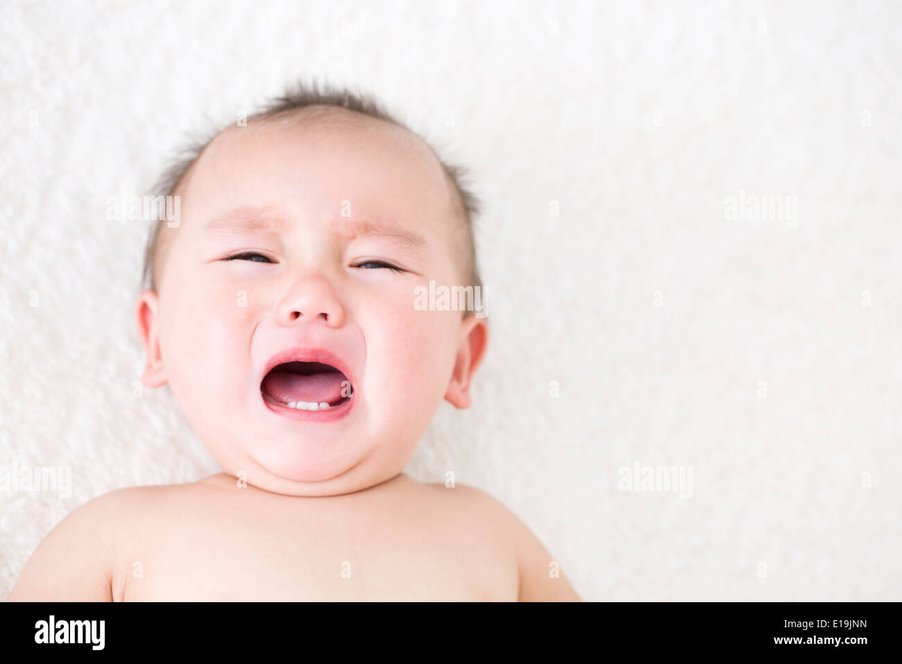 Baby boy crying Stock Photo - Alamy