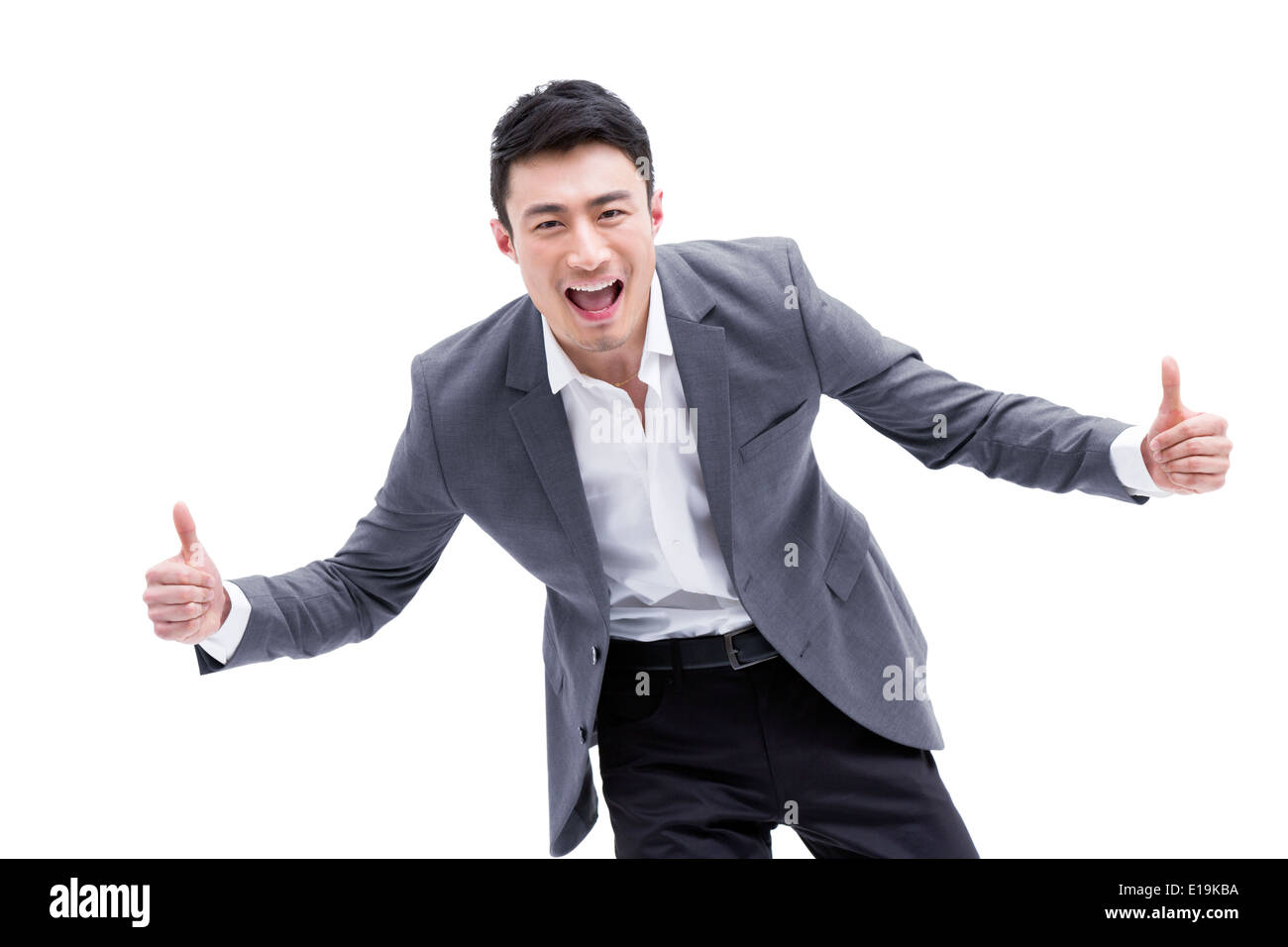 Businessman doing thumbs up standing hi-res stock photography and ...