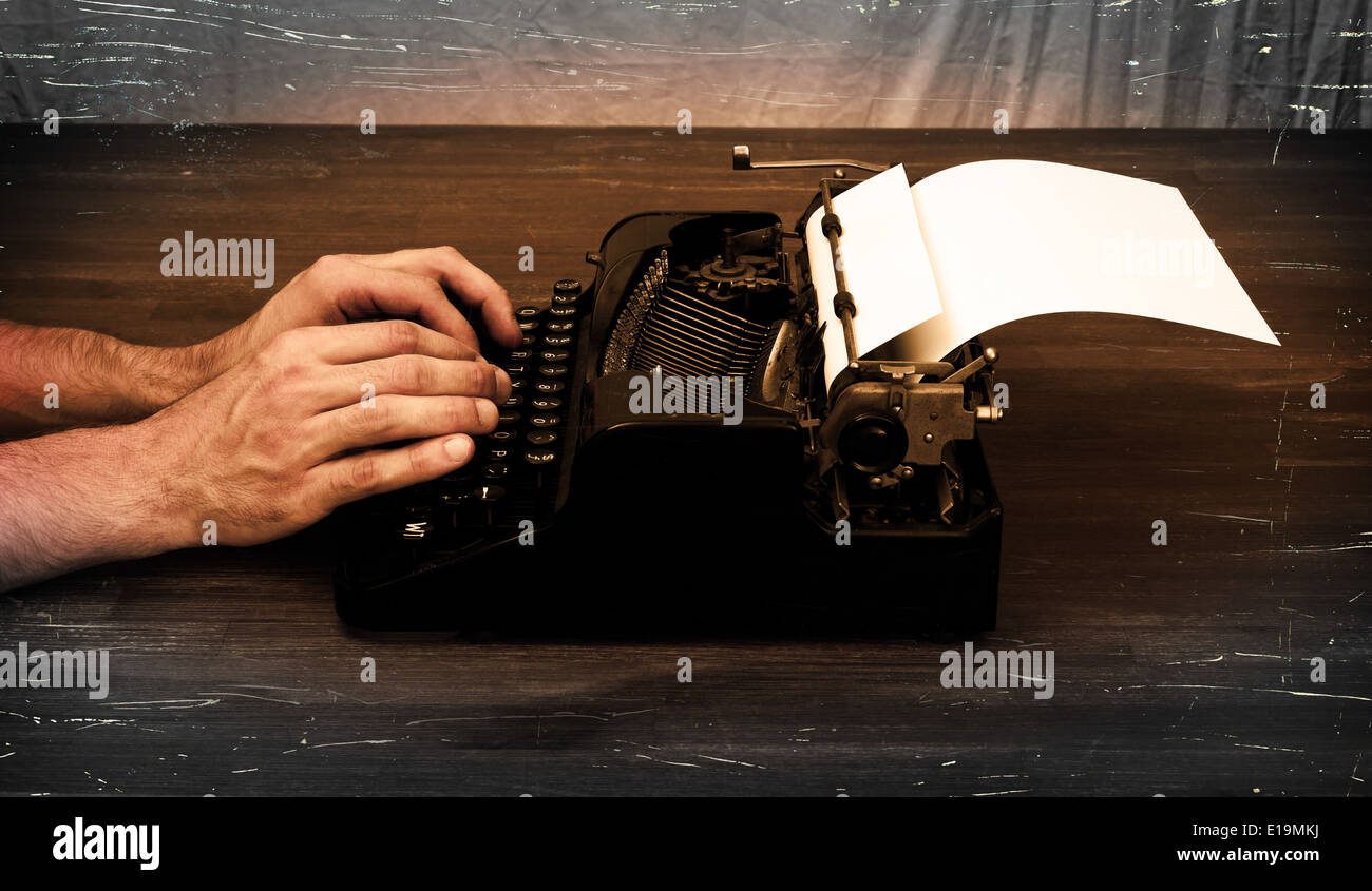 Writer or reporter behind the typewriter in retrostyle Stock Photo - Alamy