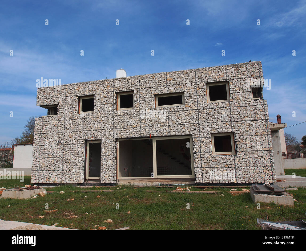 building big new ecology stone house Stock Photo - Alamy