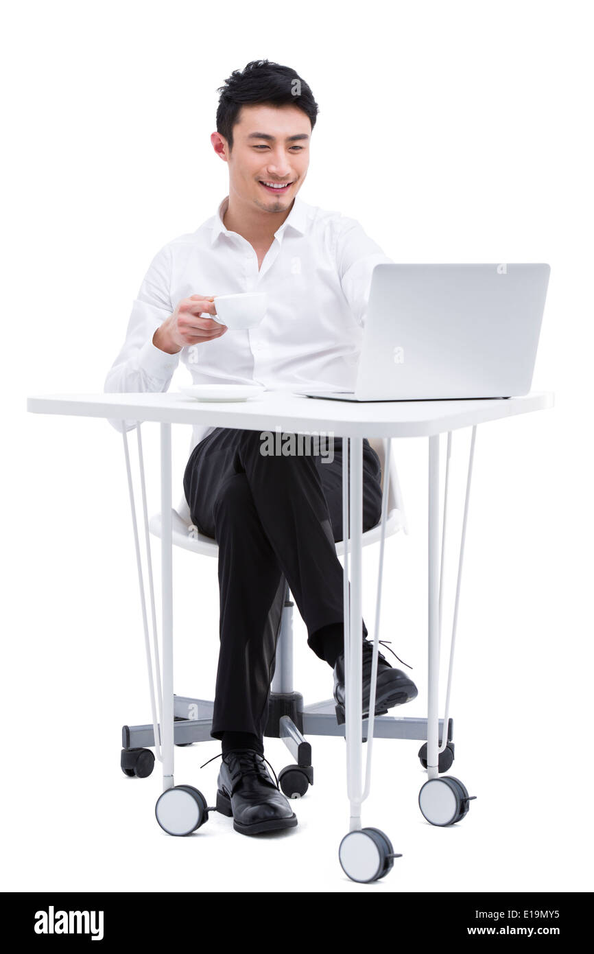 Young adult laptop coffee Cut Out Stock Images & Pictures - Alamy