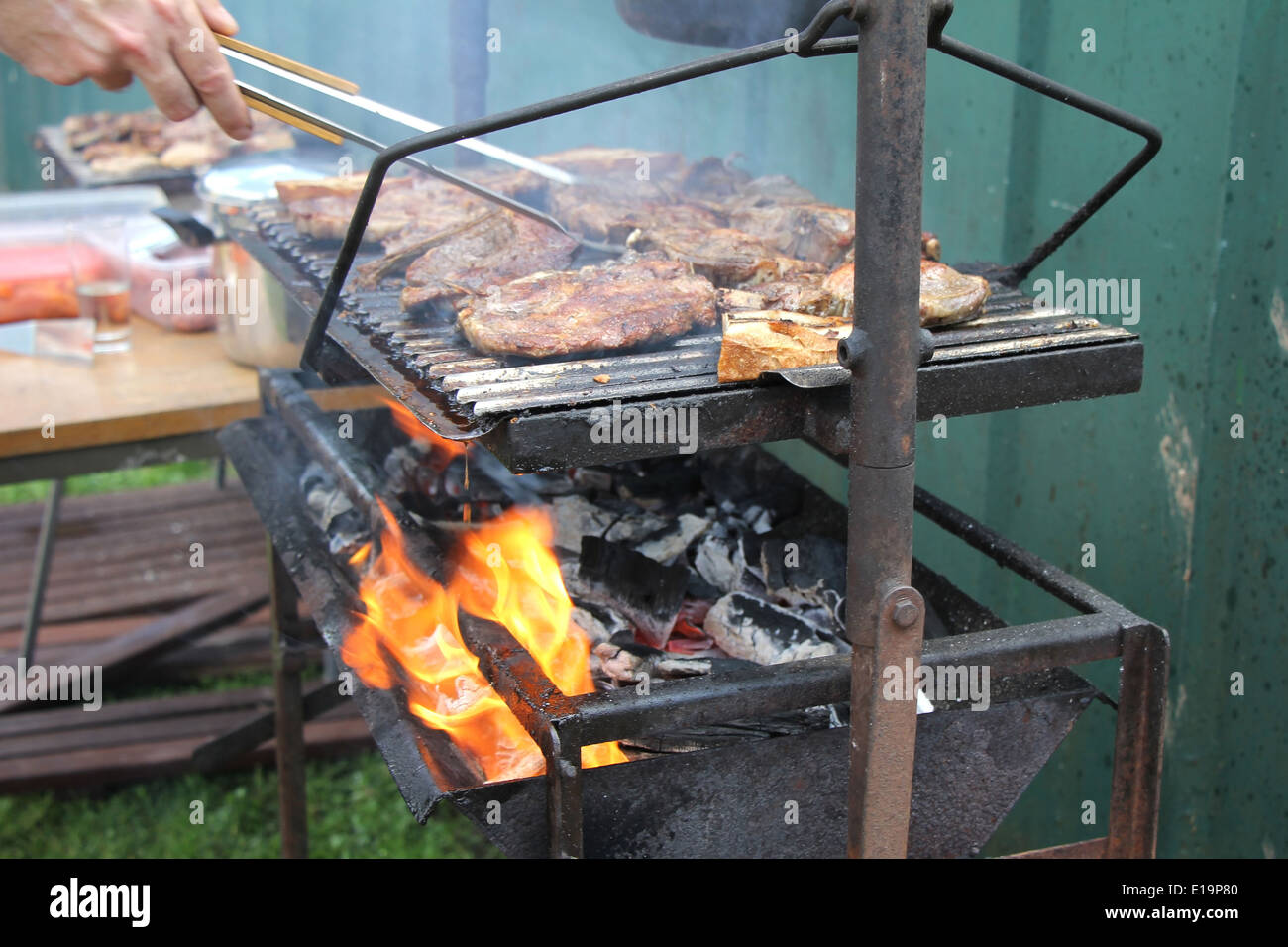 Cooking meat on fire chef hi-res stock photography and images - Alamy
