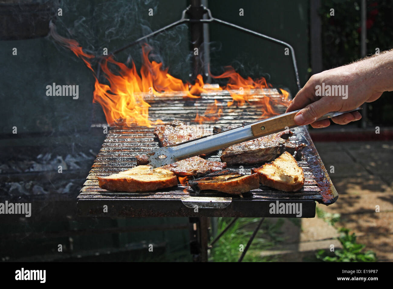 Cooking meat on fire chef hi-res stock photography and images - Alamy