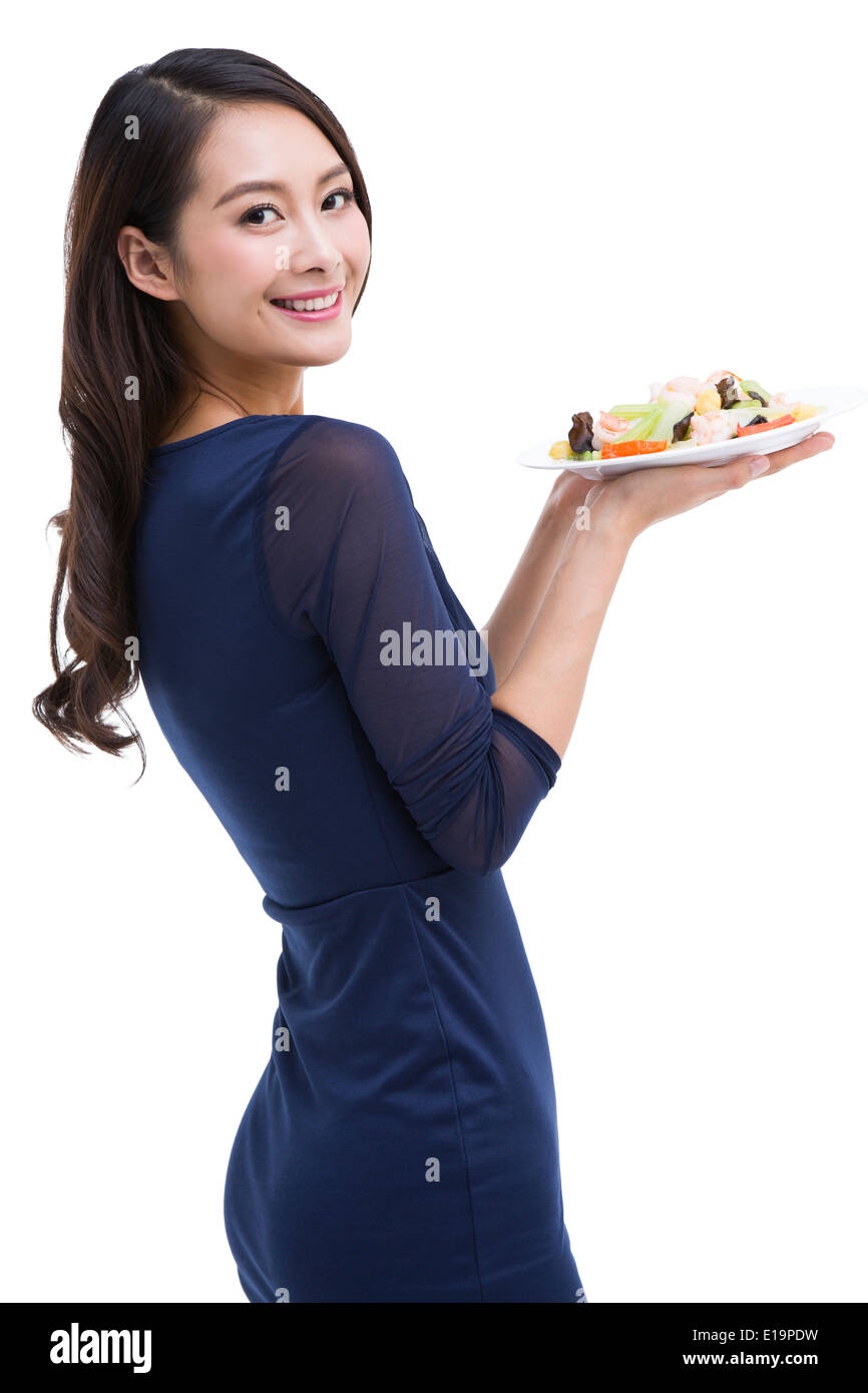Happy young woman serving food Stock Photo - Alamy