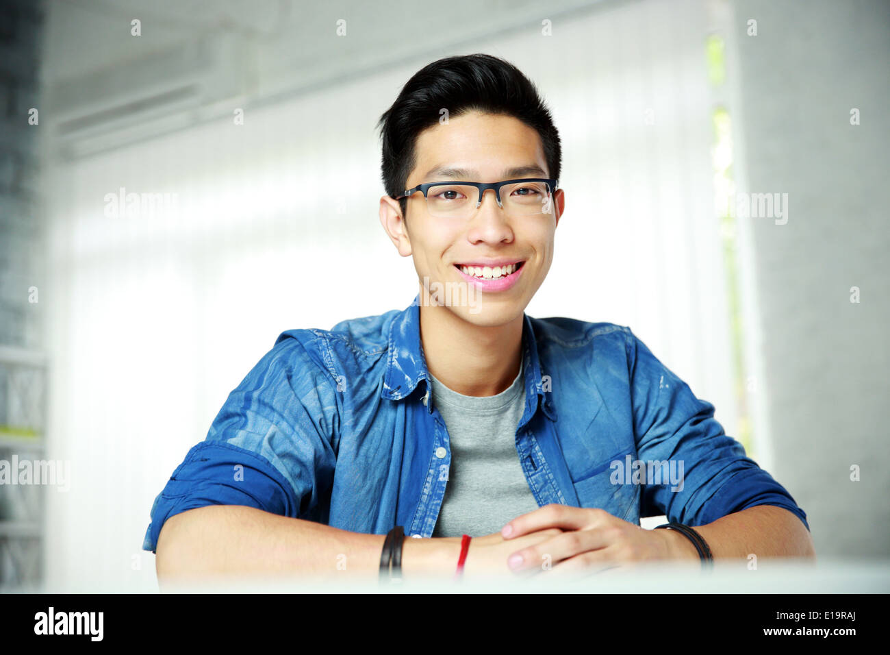 Young man thinking asian hi-res stock photography and images - Alamy