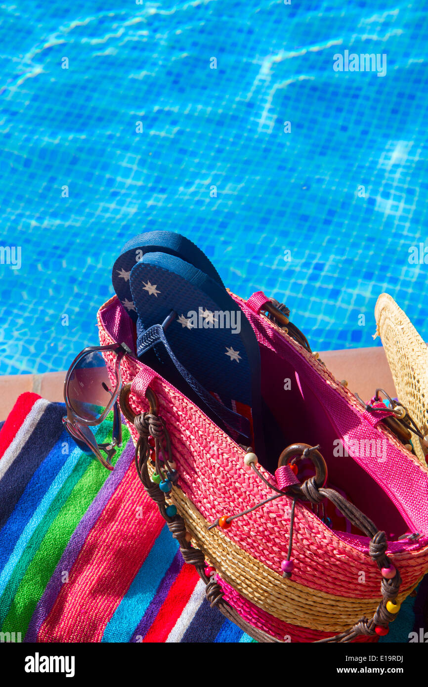 towel and bathing accessories near pool Stock Photo - Alamy