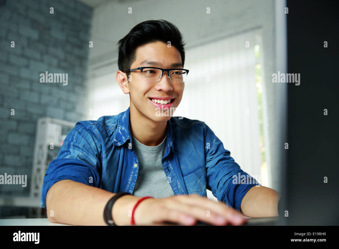 Happy attractive asian young man hi-res stock photography and images ...