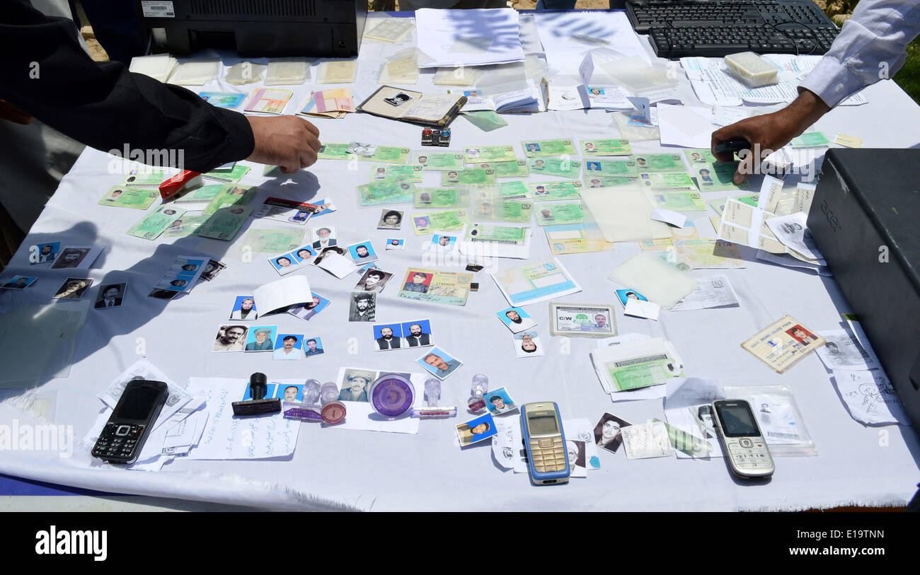 Quetta. 28th May, 2014. Security officials show seized fake identity ...
