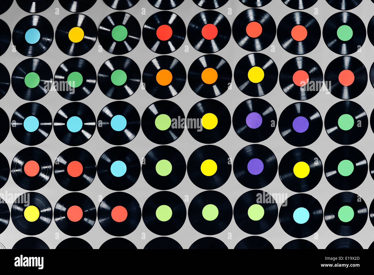 Colorful collection of vinyl records on grey background, top view ...