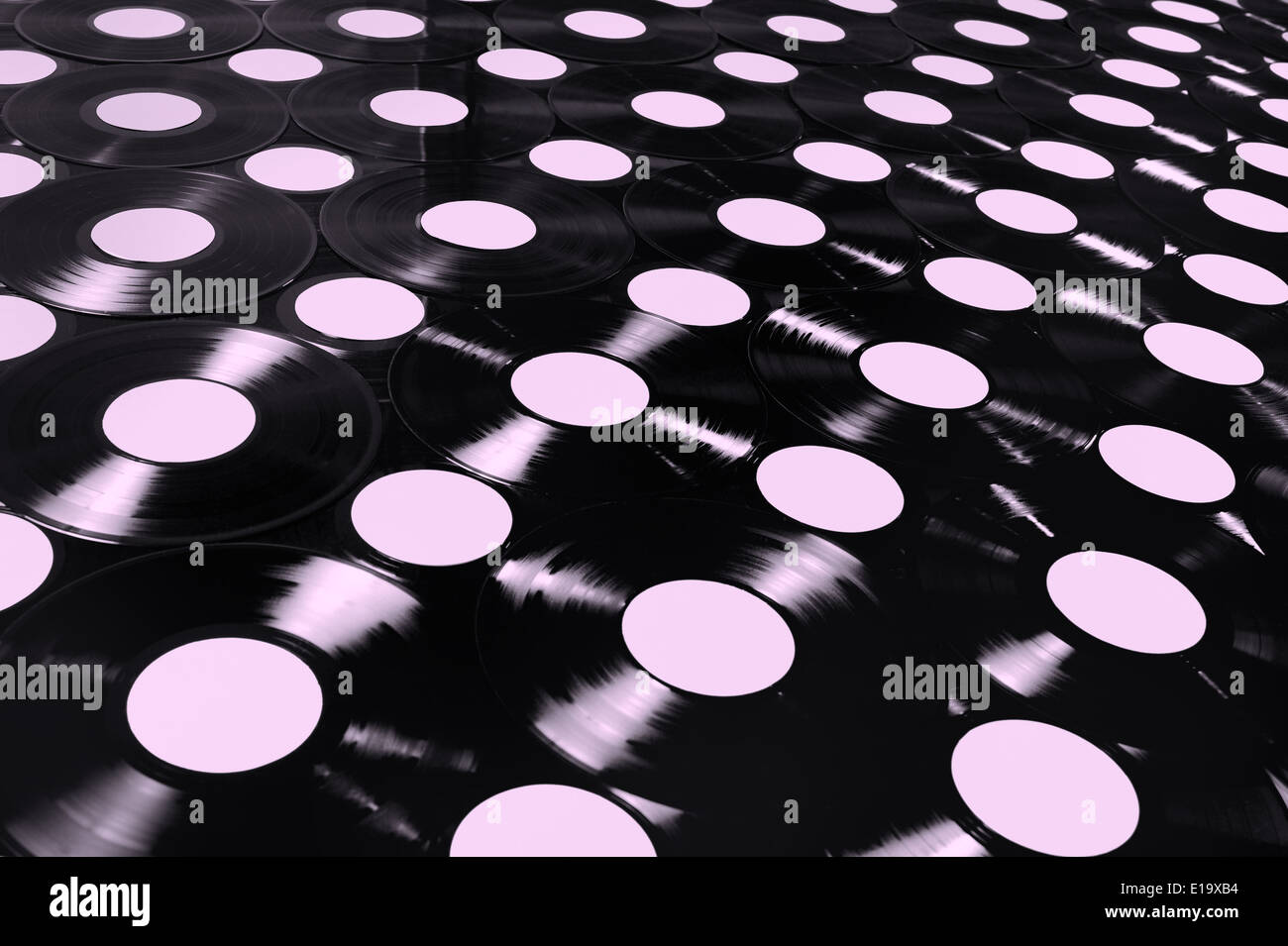 Collection of vinyl records, duo tone, angle view. The labels can be ...