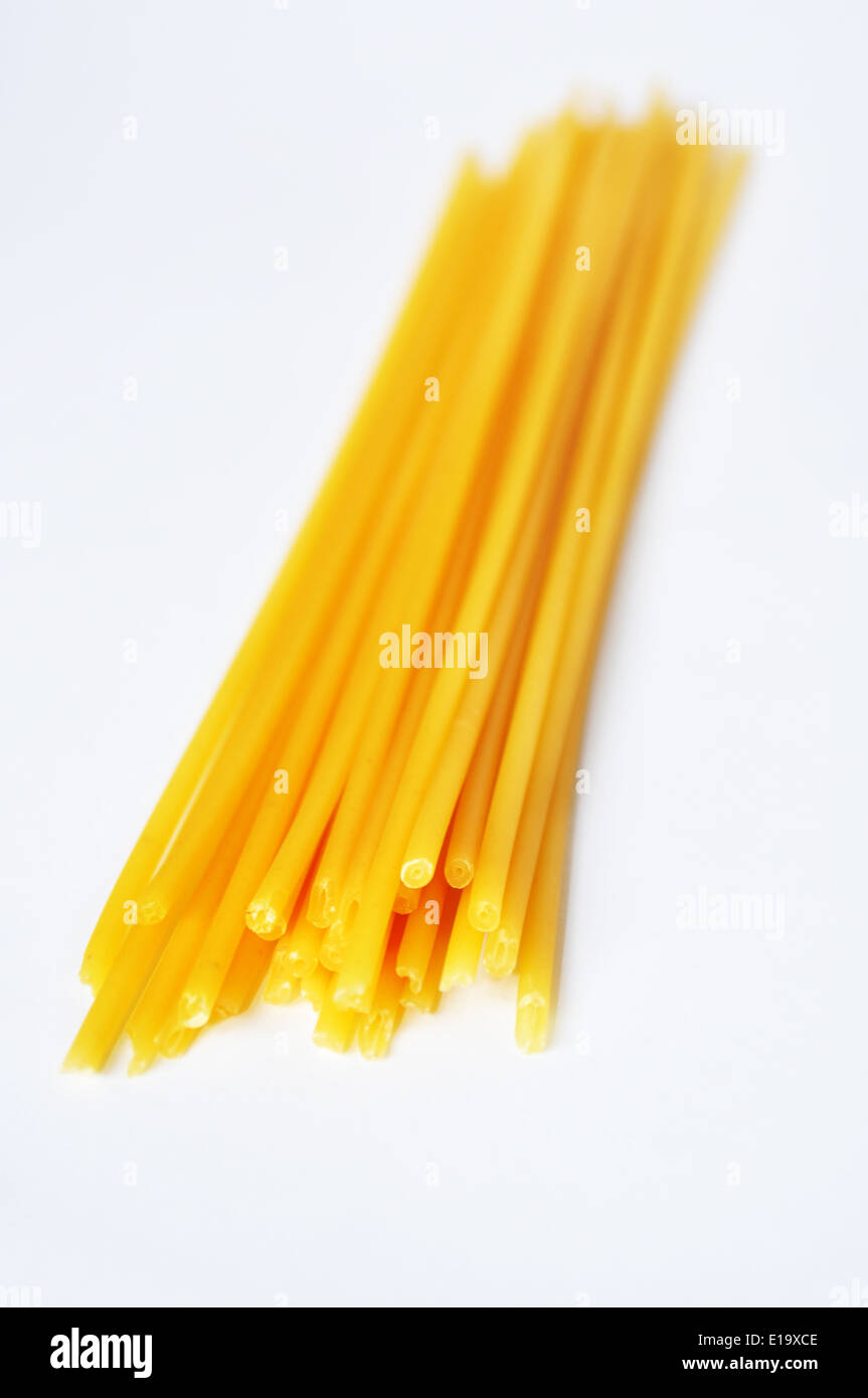 row spaghetti isolated on white background Stock Photo - Alamy