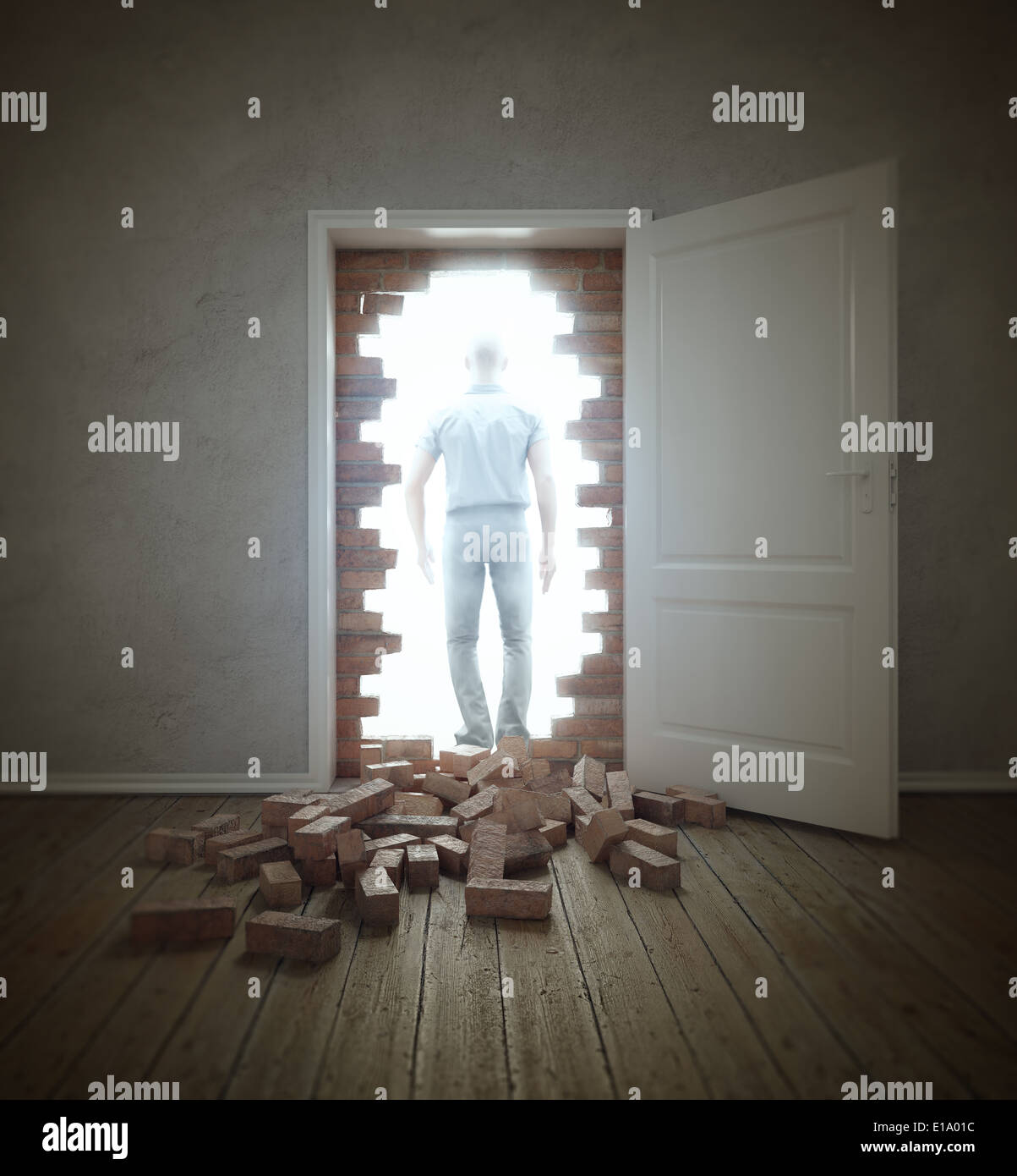 Man walking through an opening in a brick wall blocking the doorway ...