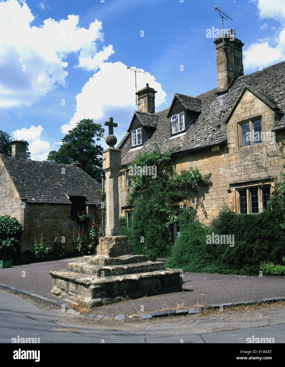The medieval stone cross in the delightful cotswold village of Stanton ...