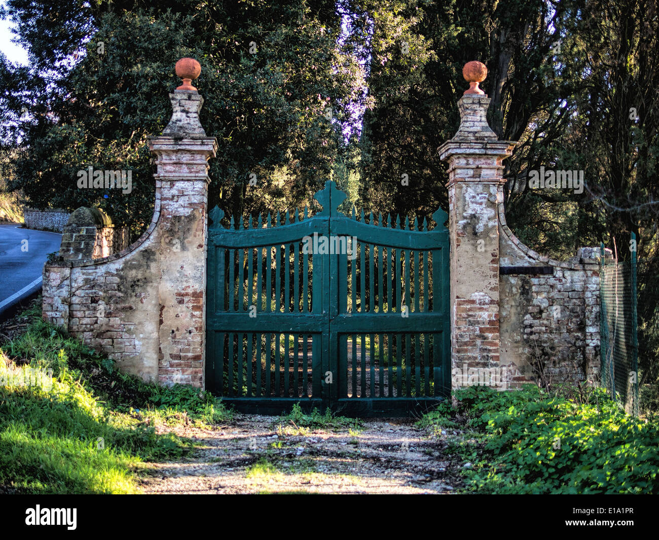 green painted wooden gate in Spello, Umbria, Italy Stock Photo - Alamy