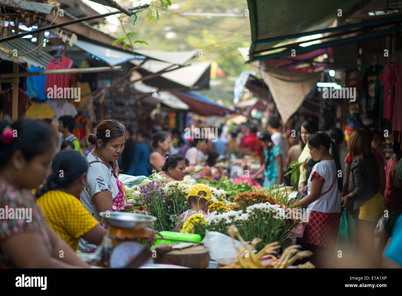 This market in Myawaddy, Myanmar is alive and bustling with activity as ...