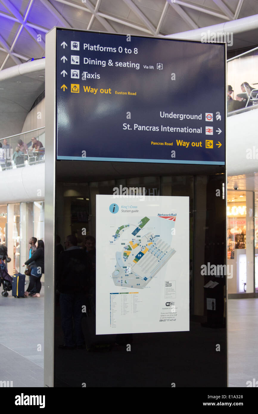 Platform sign and guide at Kings Cross station in London Stock Photo ...