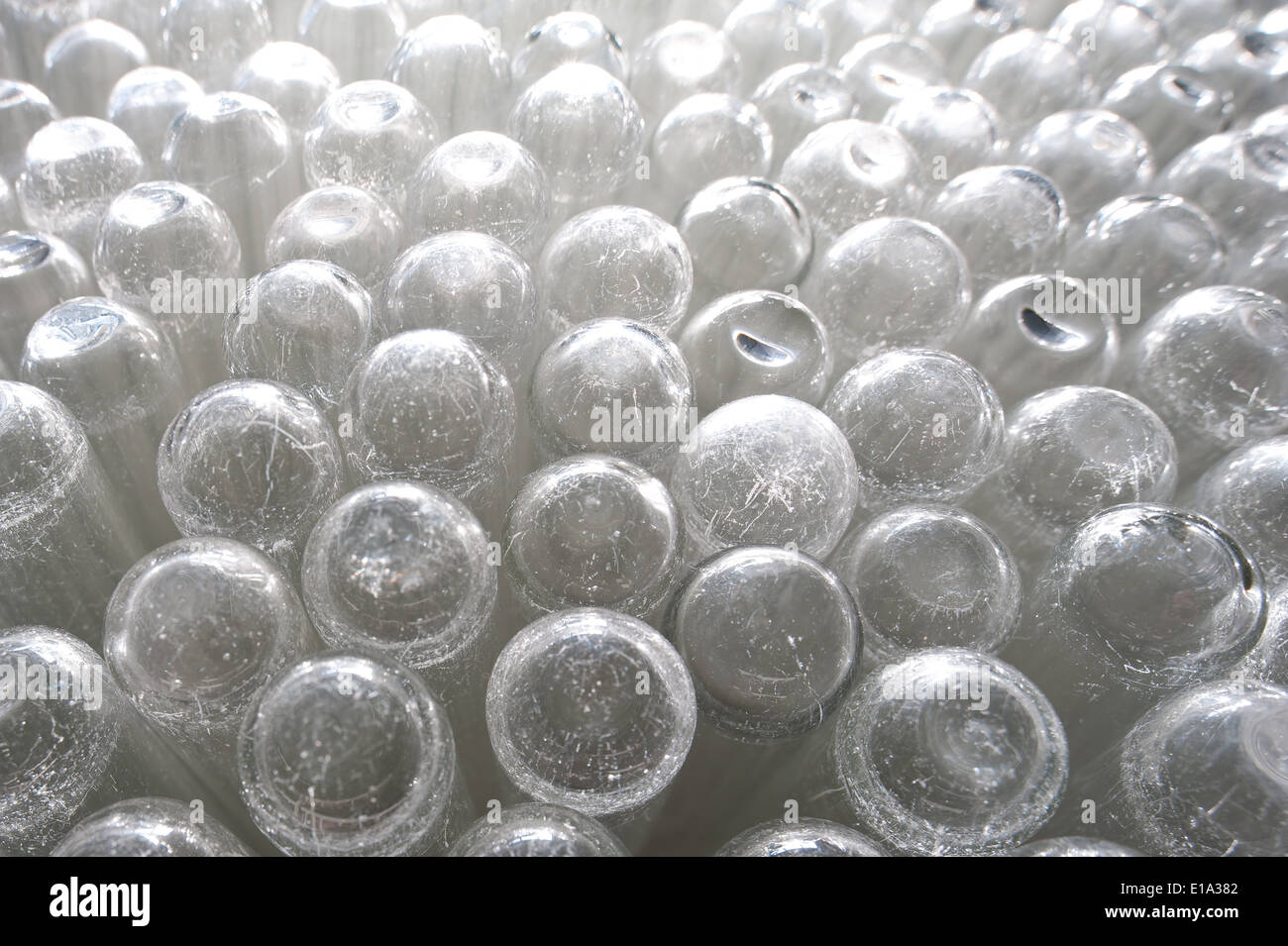 ends of upturned inverted test tubes well worn yet clean and sterilized ...