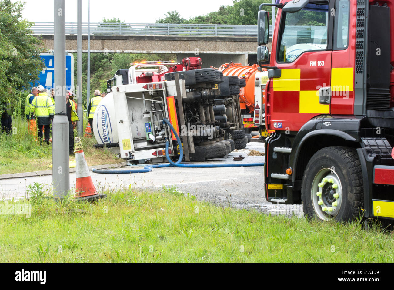 Scene of a road traffic incident with an overturned tanker and ...