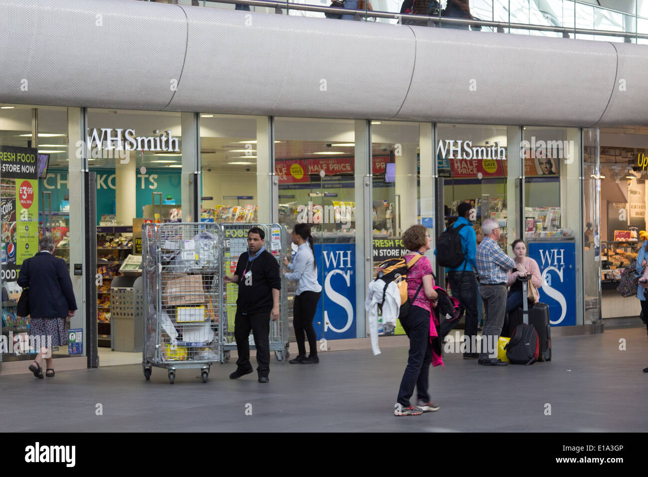 People waiting outside WH Smith newsagent at Kings Cross station Stock ...