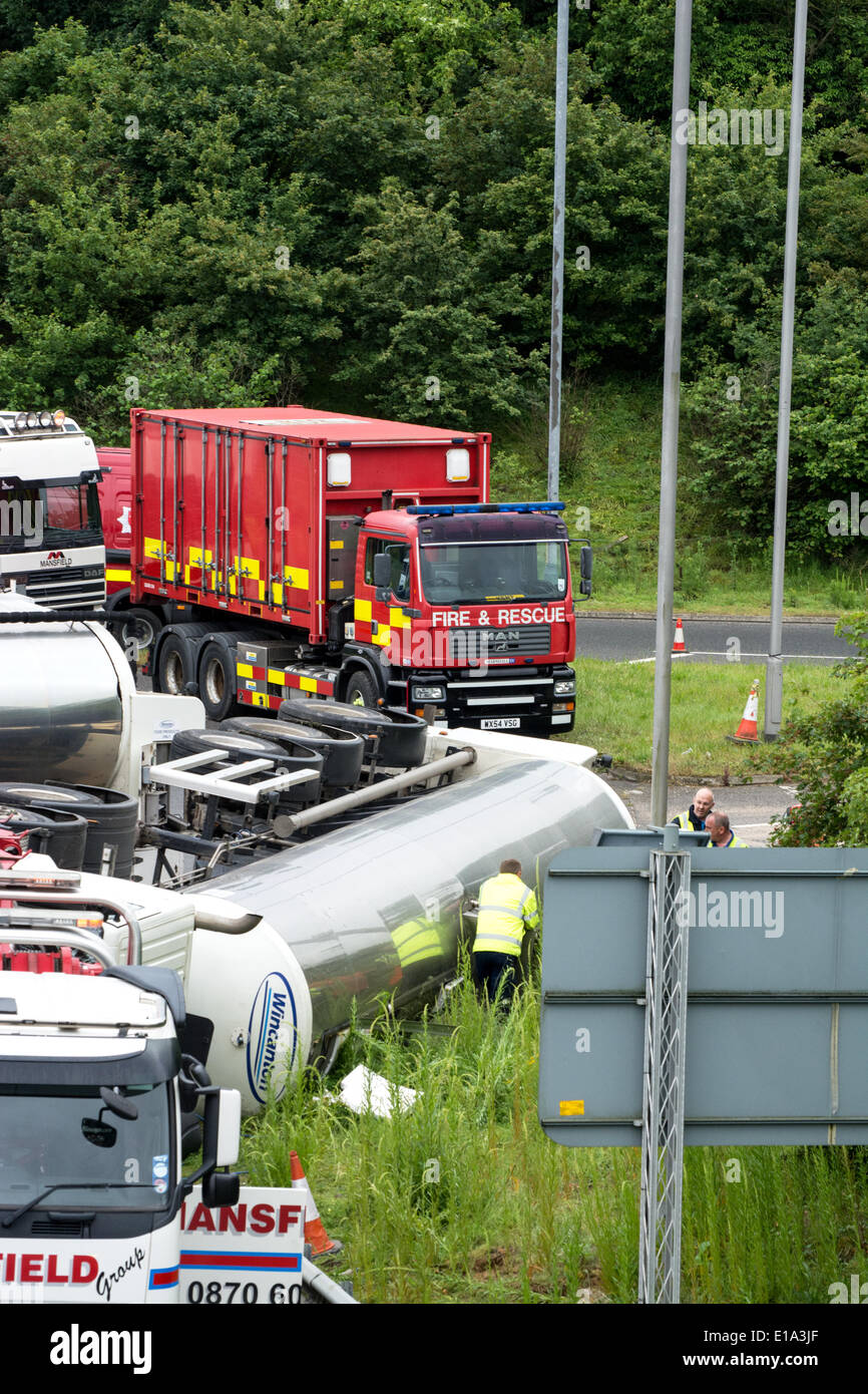 Scene of a road traffic incident with an overturned tanker and ...