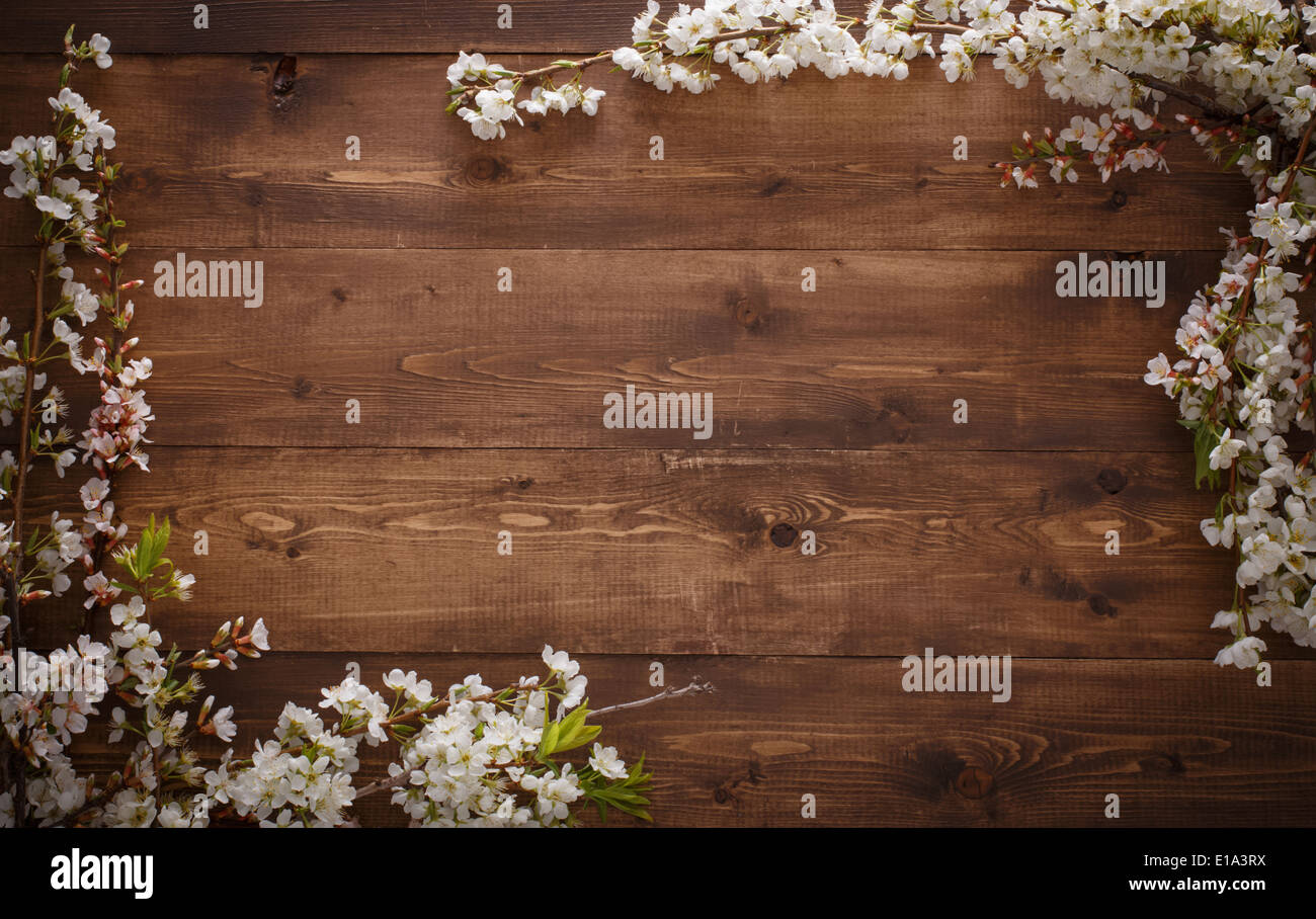 Flowers on wood texture background Stock Photo - Alamy