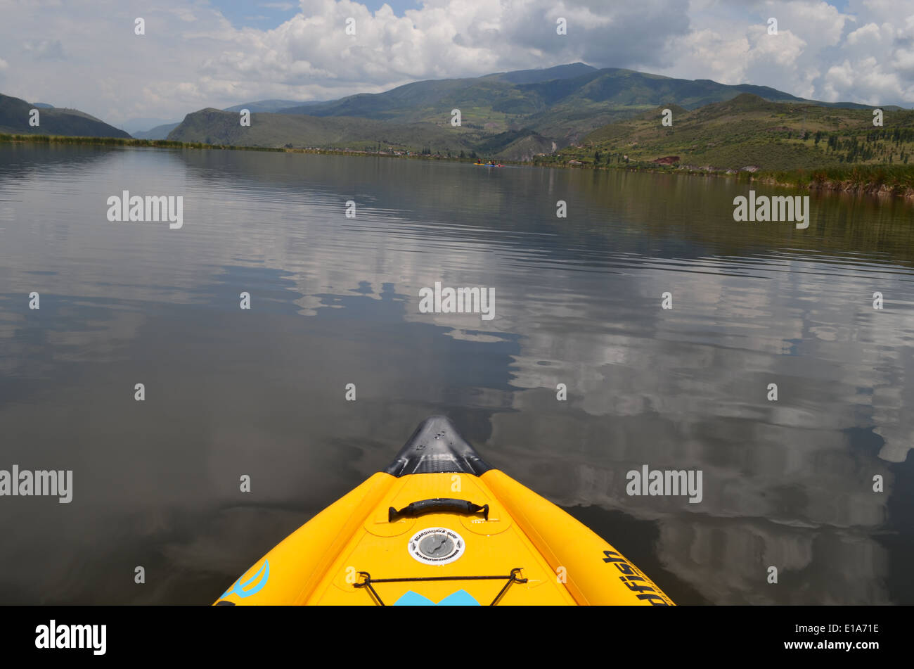 SUP Stand Up Paddleboarding on a lake close to Cusco, Peru with the ...