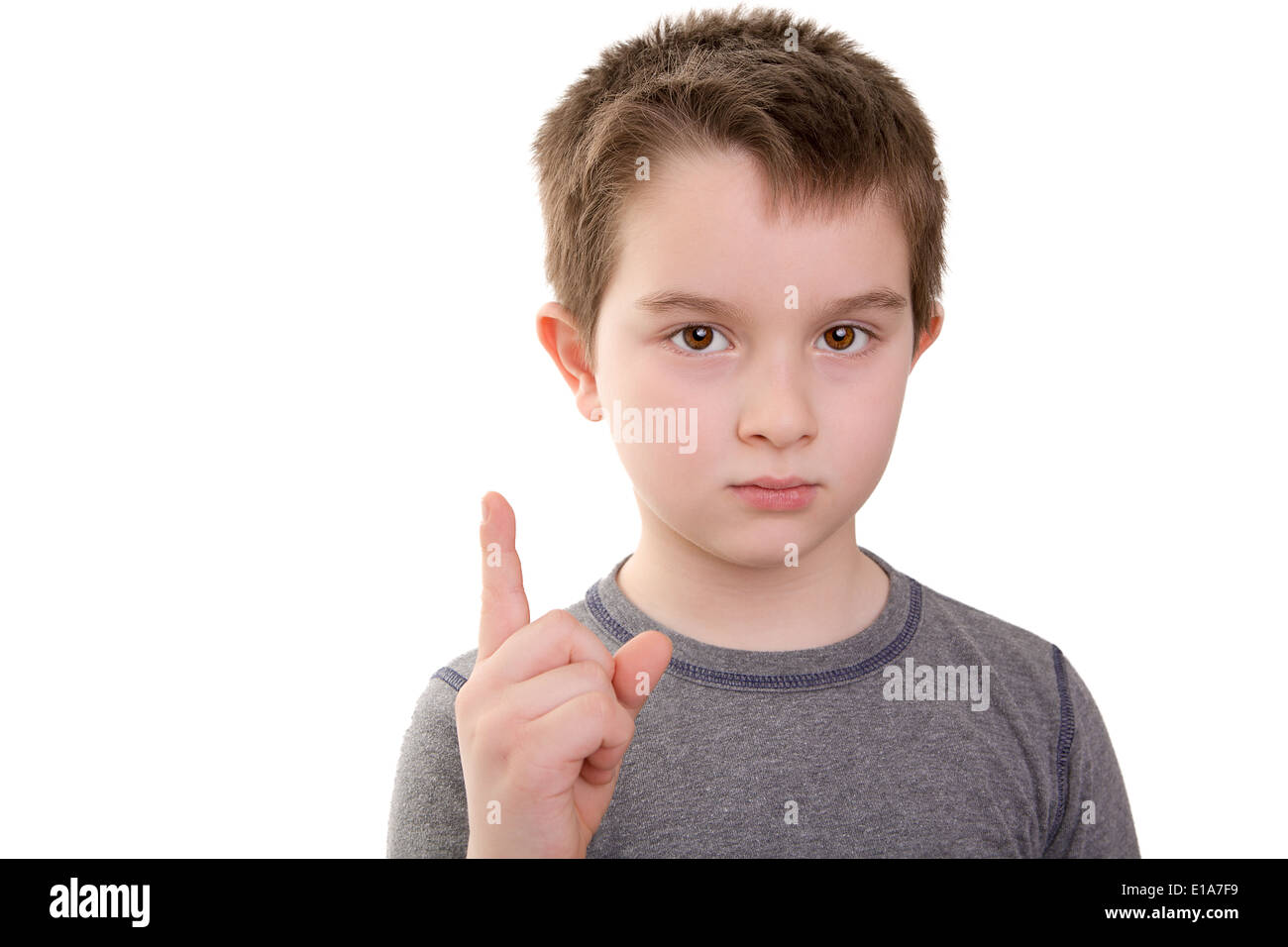 Elementary school kid giving a strong serious watch yourself impression ...