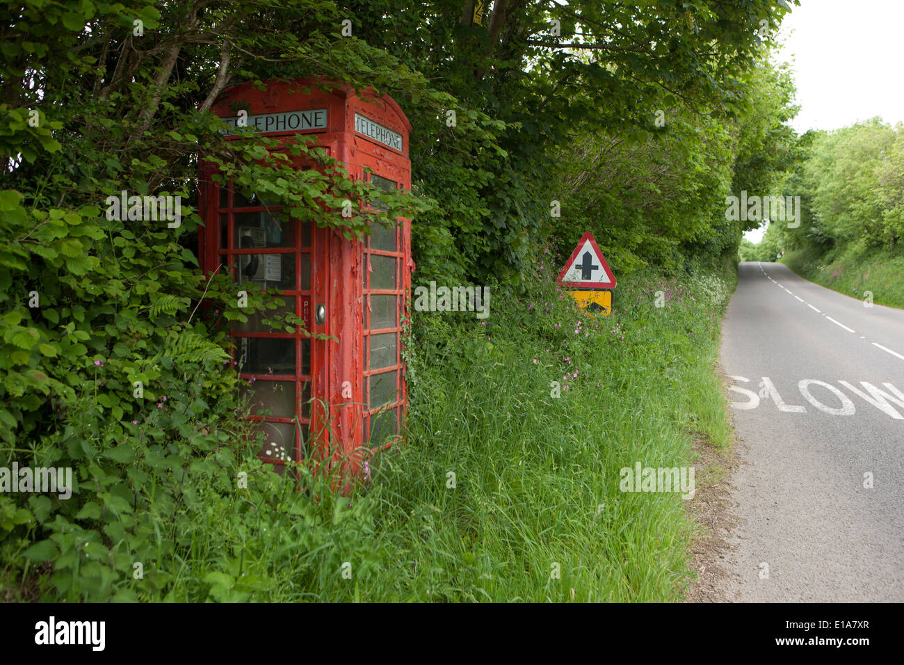 Red telephone box overgrown plants hi-res stock photography and images ...