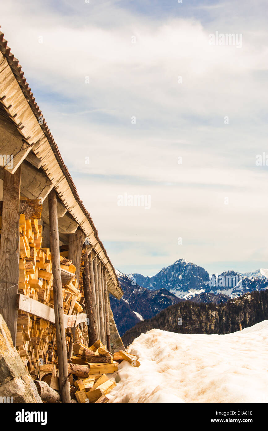 pile of wood down the roof of a hut in the italian alps Stock Photo - Alamy
