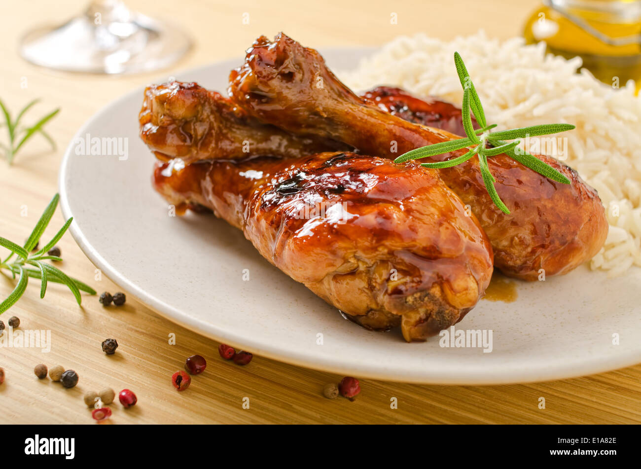 Barbecued chicken legs with white rice Stock Photo - Alamy