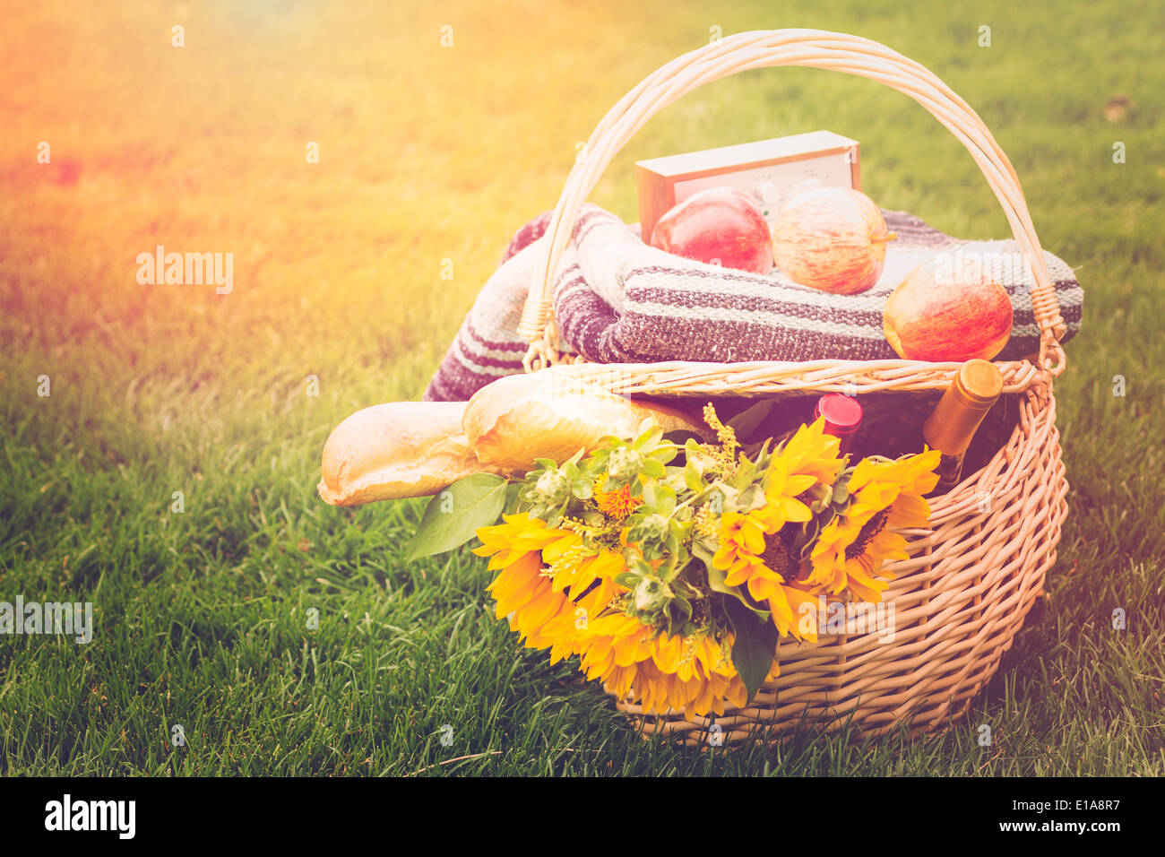 Summer picnic with a basket of food in the park Stock Photo - Alamy