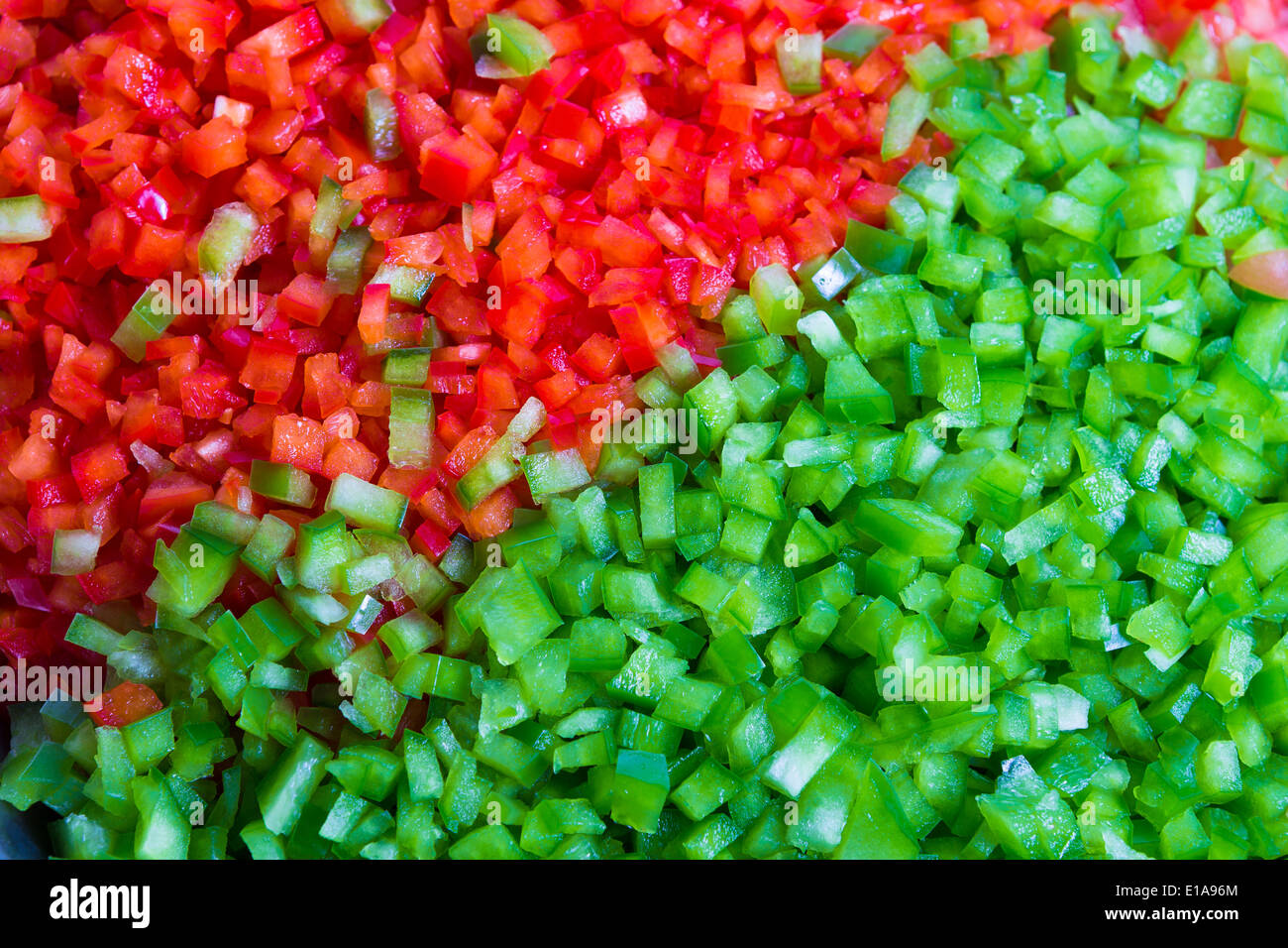 Chopped green and red bell peppers cleaned and washed as cooking ...