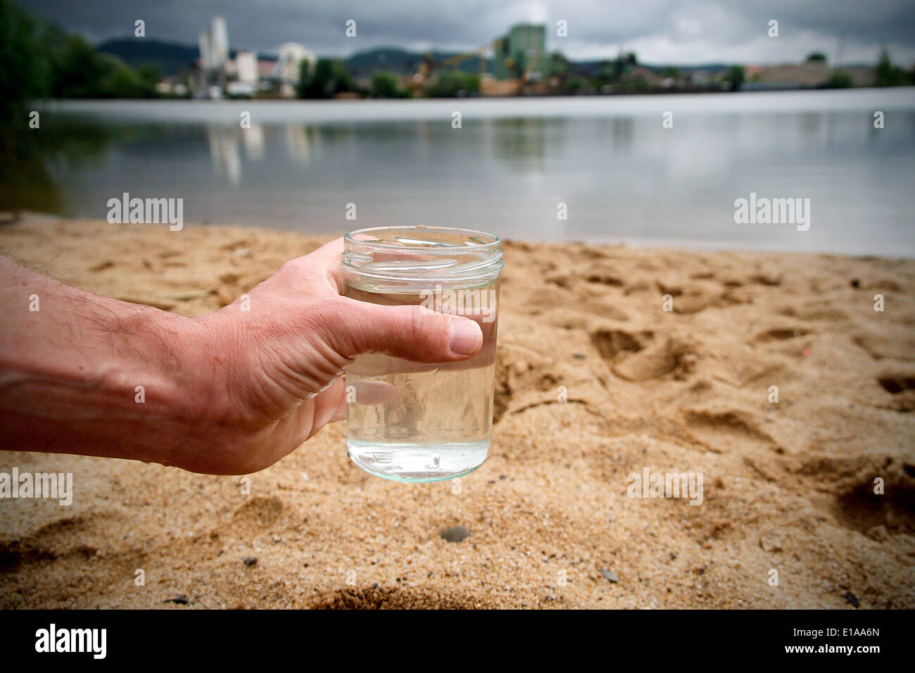 A glass filled with water of lake Sander is pictured in Sand am Main ...
