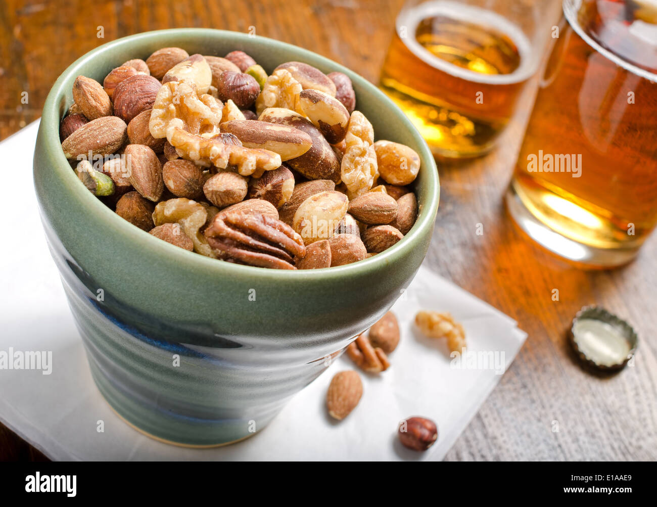 A bowl of mixed nuts with beer Stock Photo - Alamy