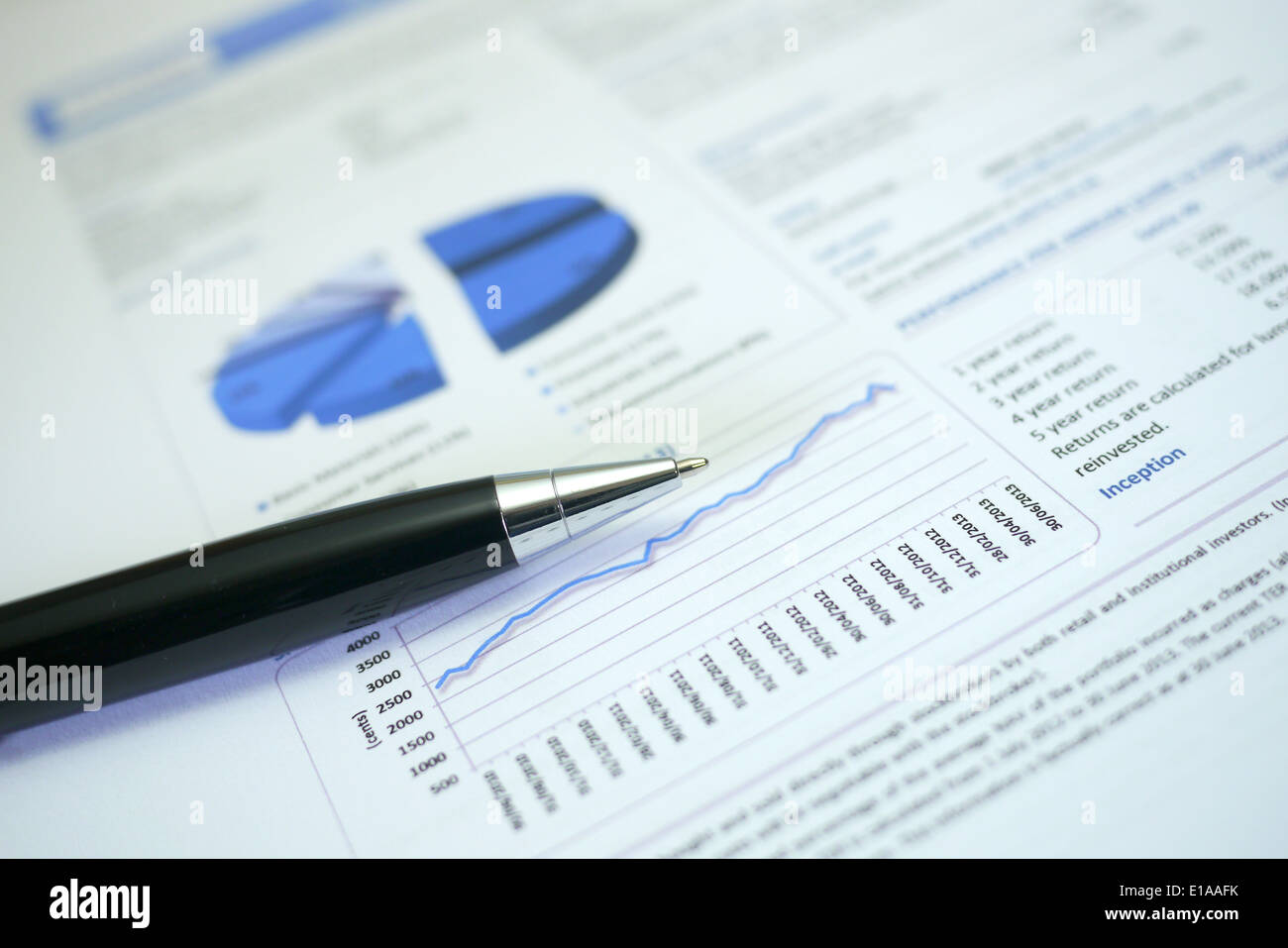 shallow focus on black pen and financial document Stock Photo - Alamy